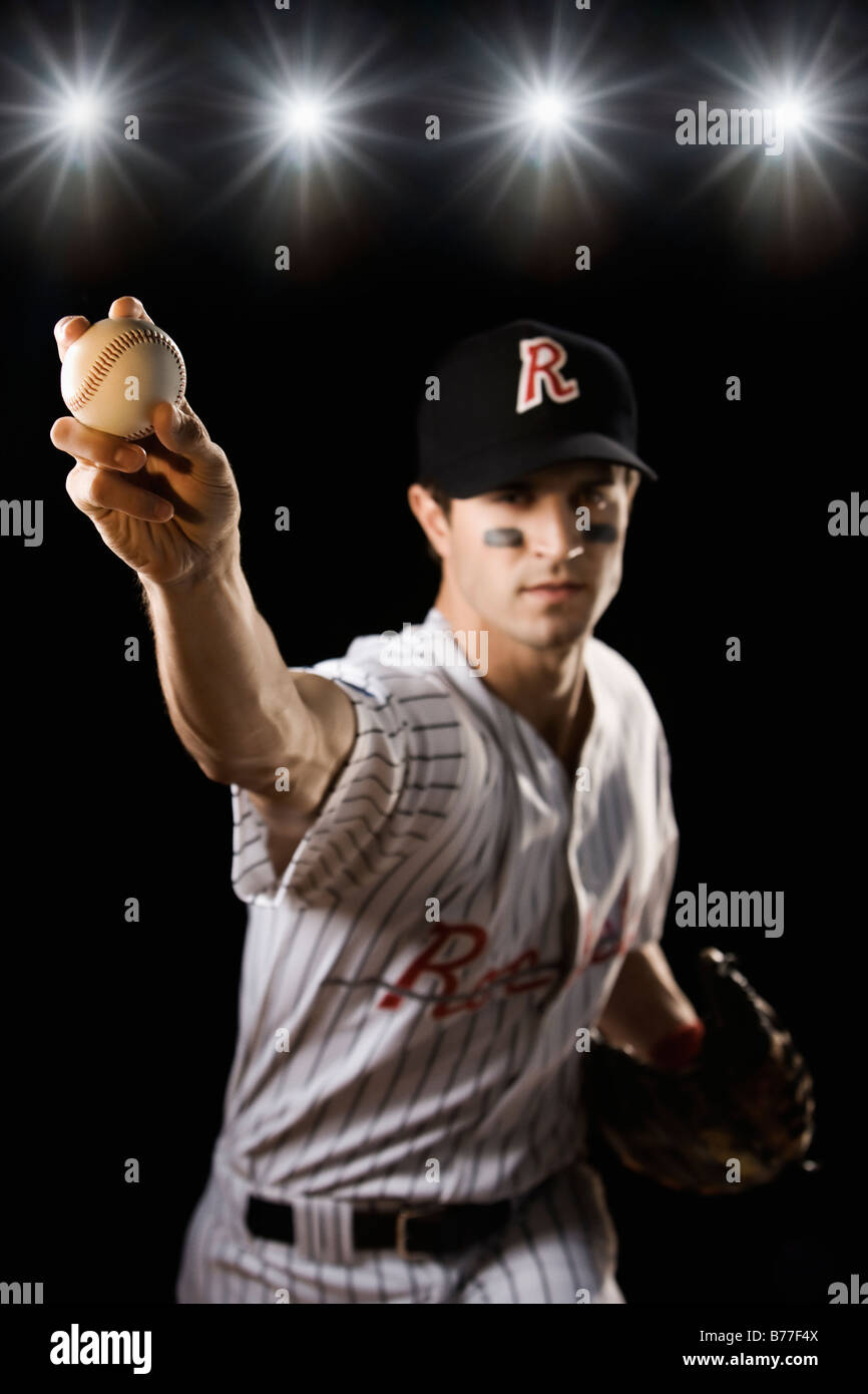 Portrait of pitcher throwing baseball Stock Photo - Alamy