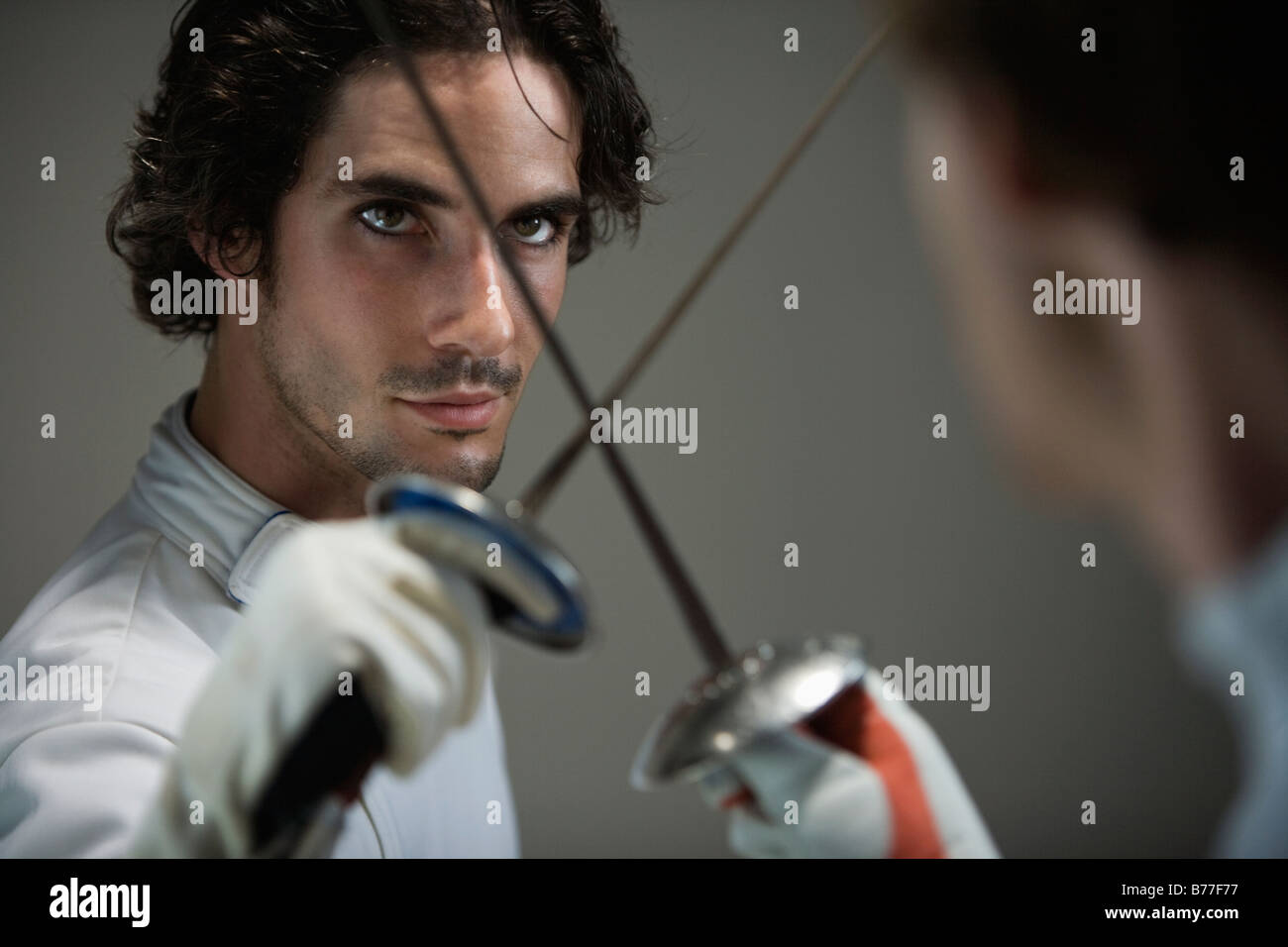 Close up of men fencing Stock Photo - Alamy