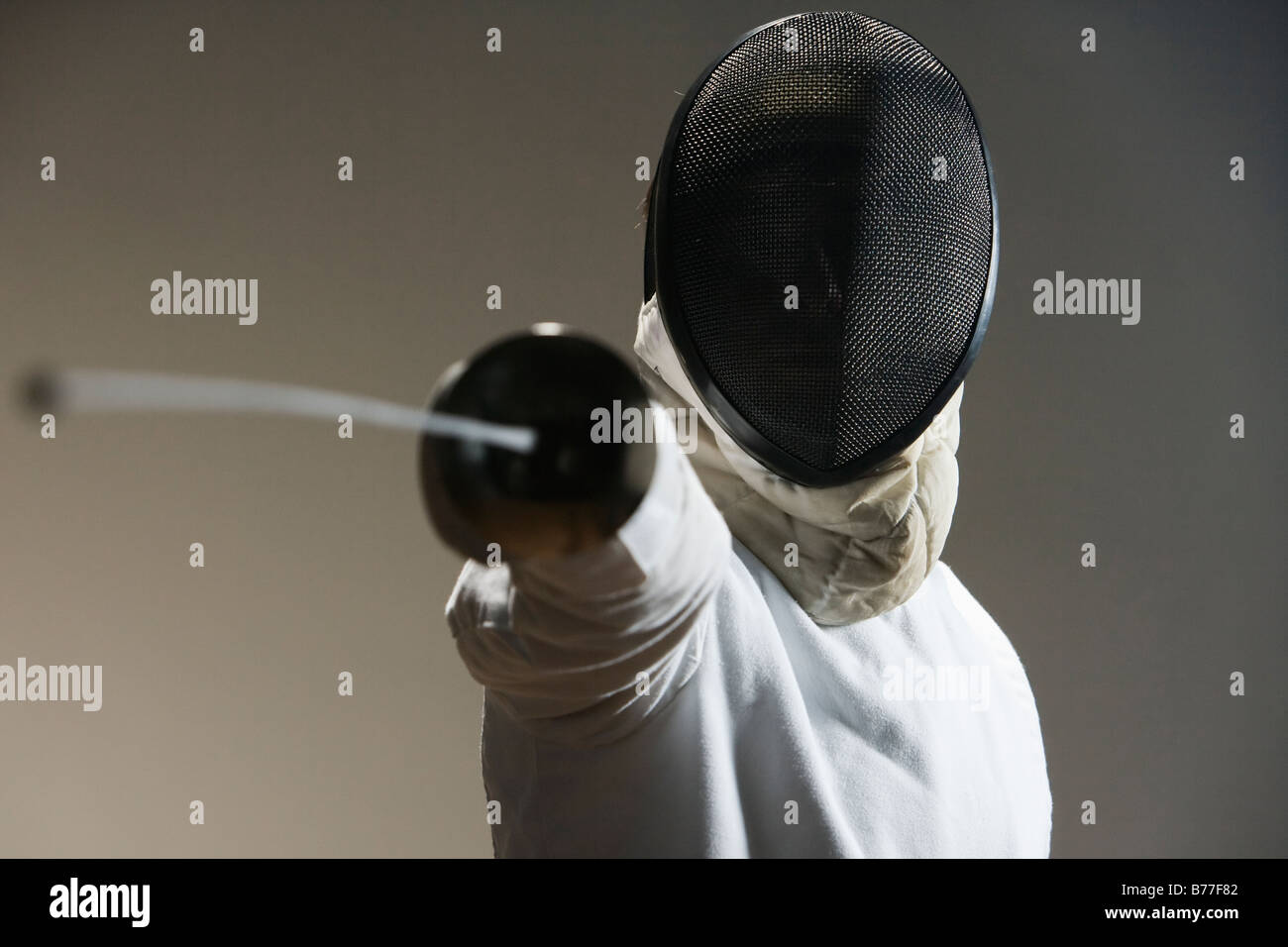 Close up of fencer mask pointing fencing foil Stock Photo - Alamy