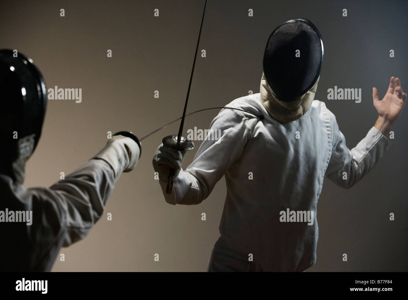 Two men fencing Stock Photo - Alamy