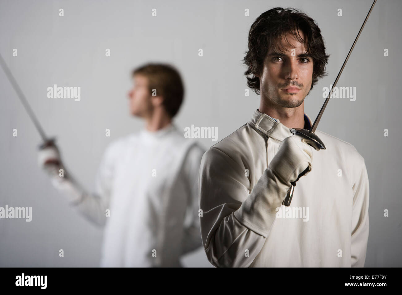 Portrait of fencers holding fencing foils Stock Photo - Alamy