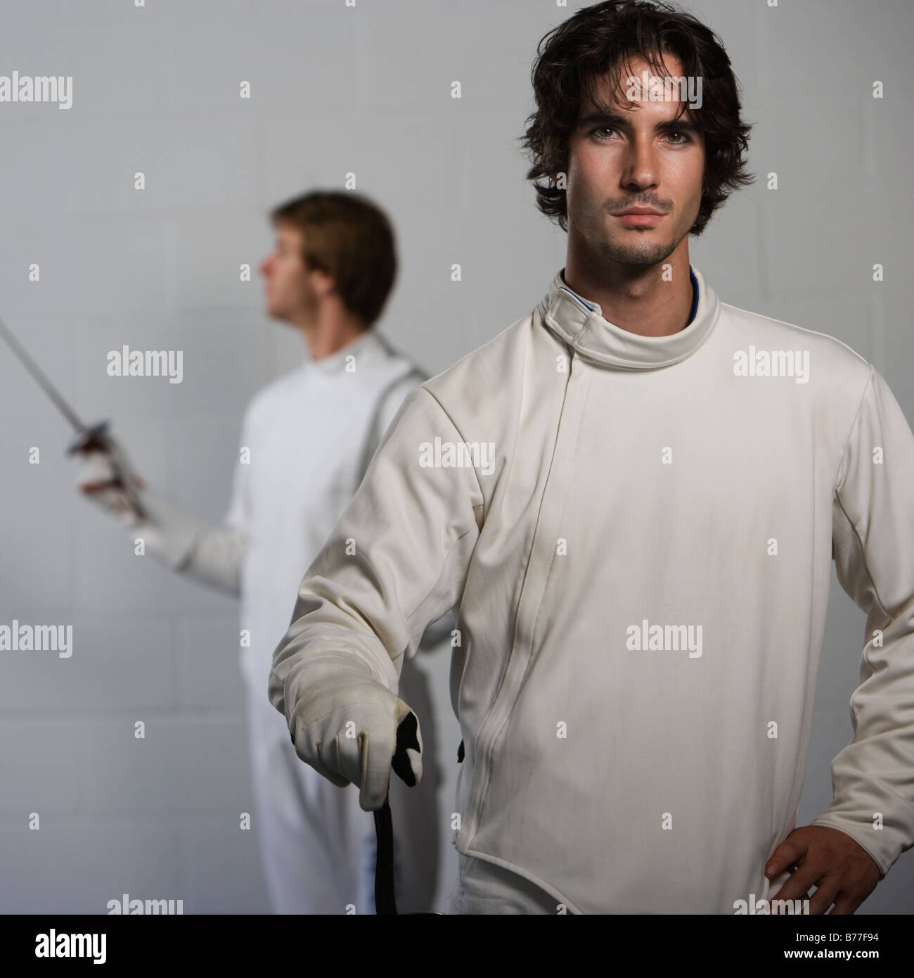 Portrait of fencers holding fencing foils Stock Photo - Alamy