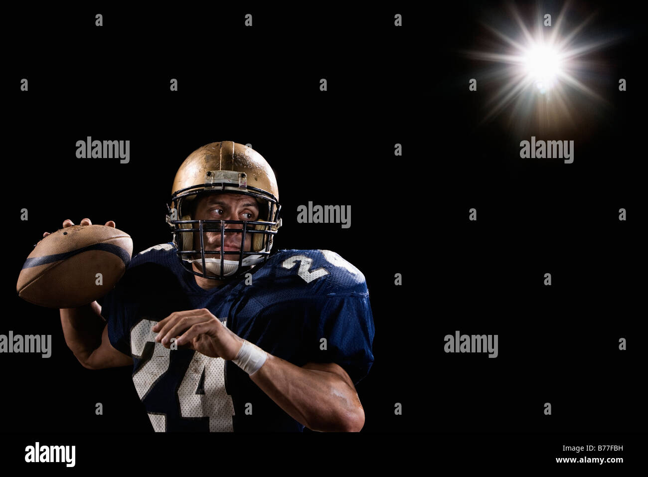 Quarterback throwing football Stock Photo - Alamy