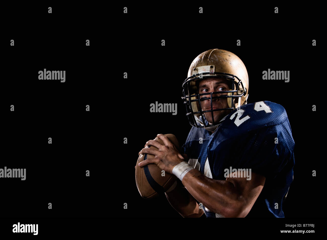 Quarterback preparing to throw football Stock Photo - Alamy