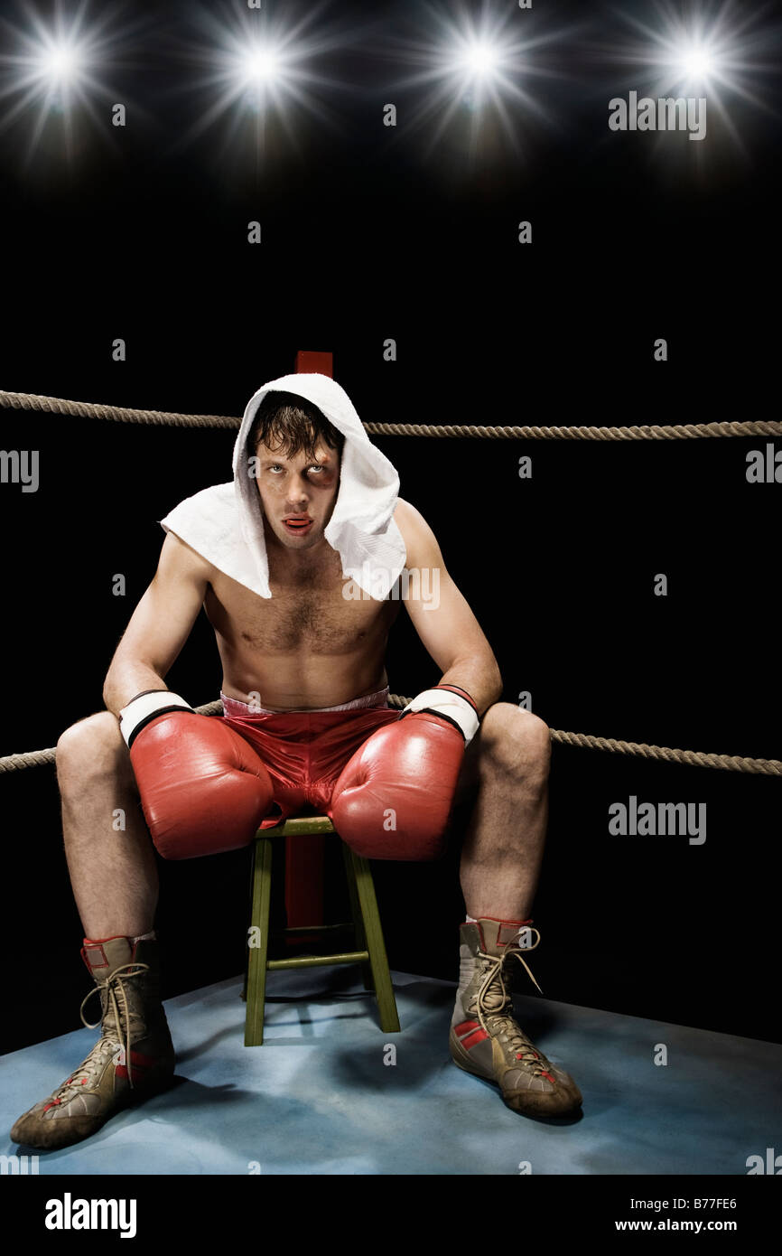 Boxer sitting on stool corner of boxing ring Stock Photo - Alamy
