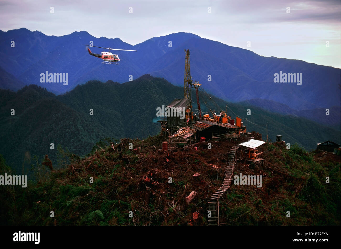 Helicopter flying over oil drilling platform Indonesia Stock Photo - Alamy