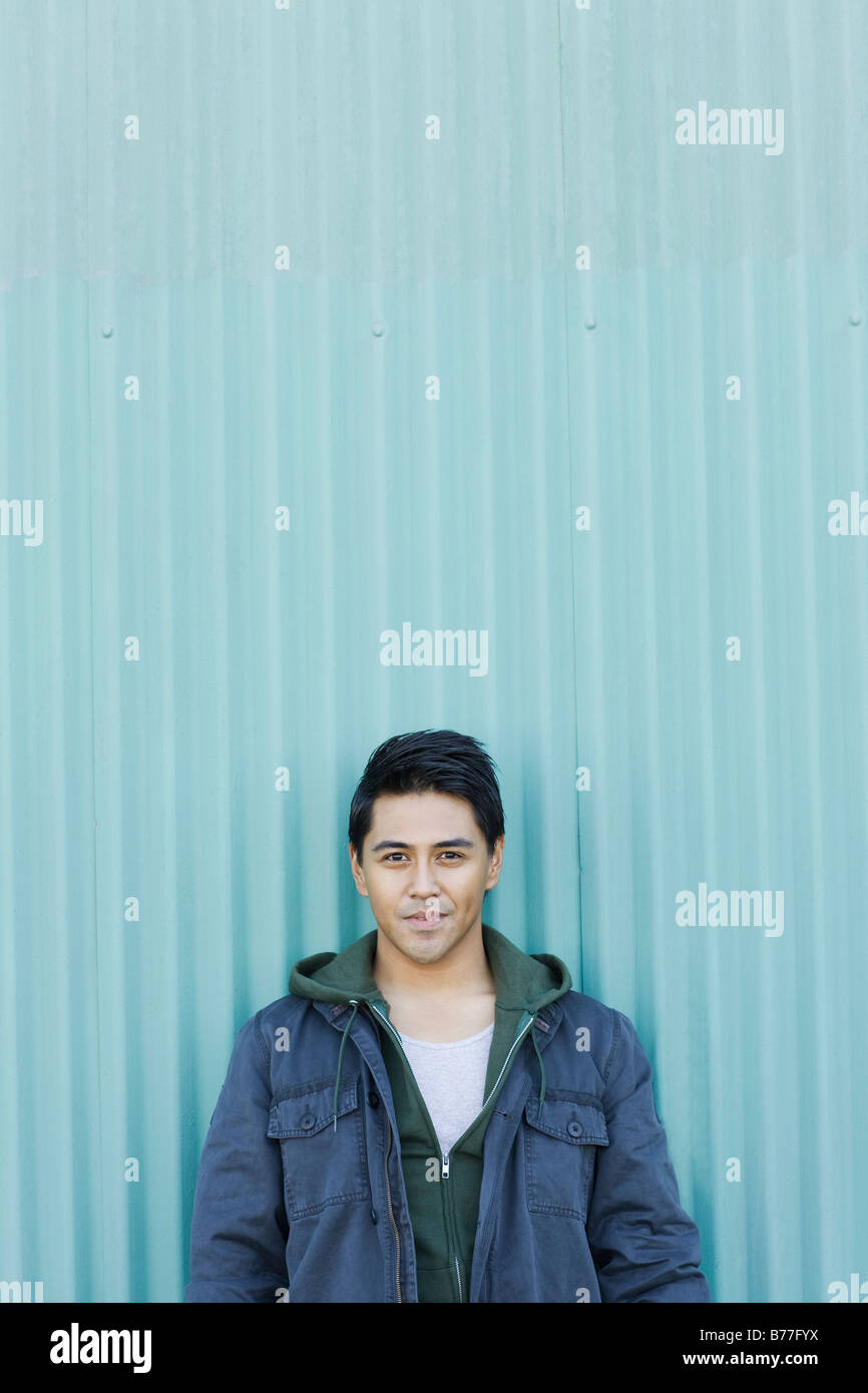Man posing against wall Stock Photo - Alamy