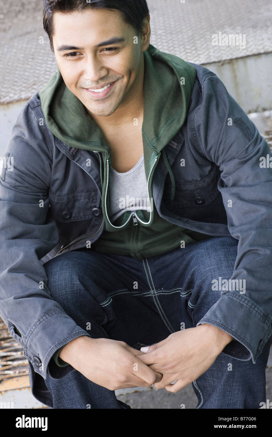 Man sitting on step Stock Photo - Alamy