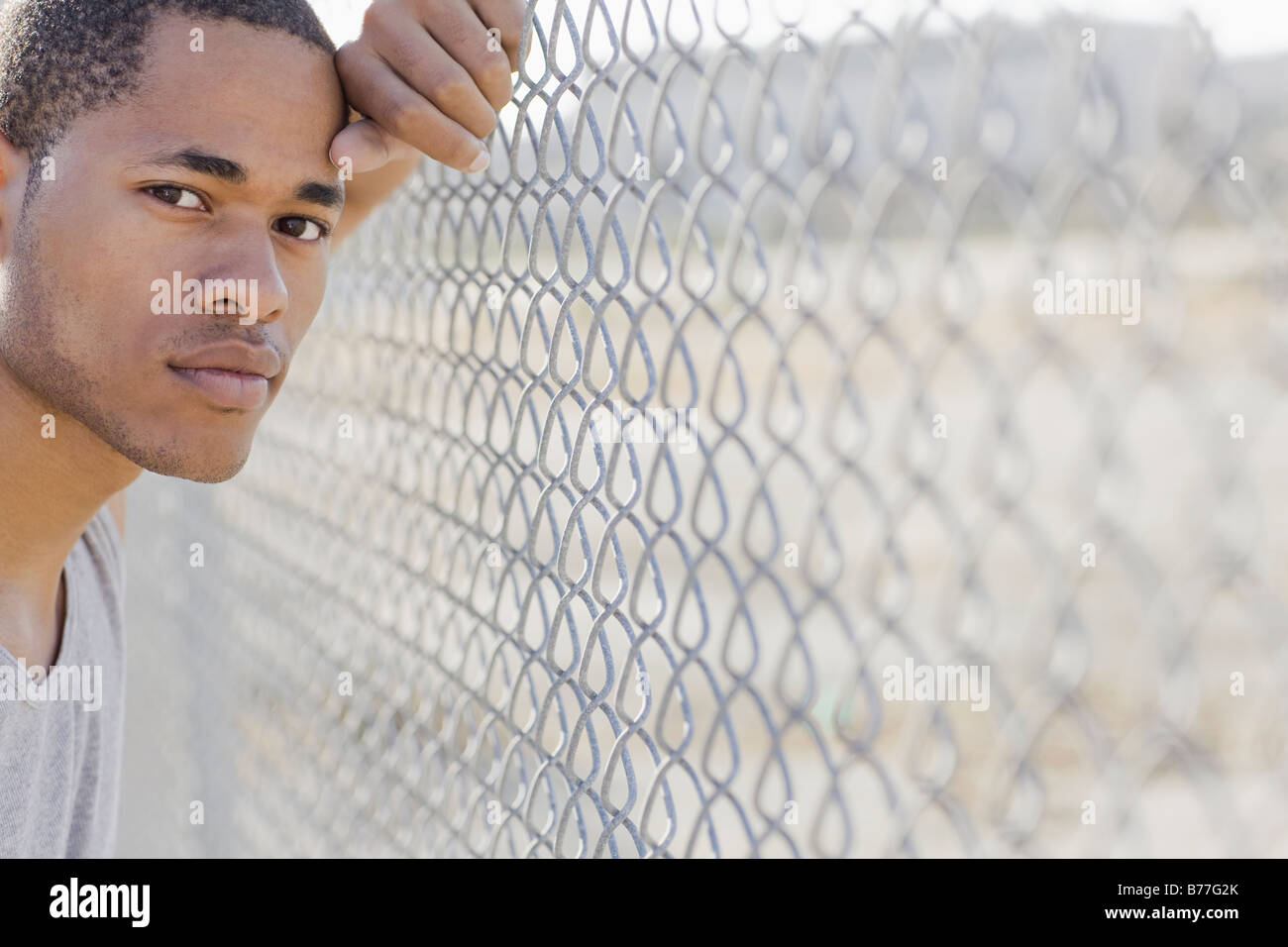 Leaning against barrier hi-res stock photography and images - Alamy