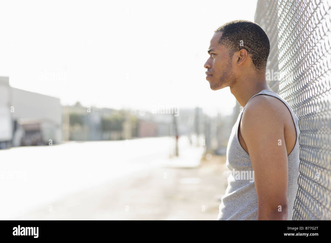 Male lean against fence hi-res stock photography and images - Alamy