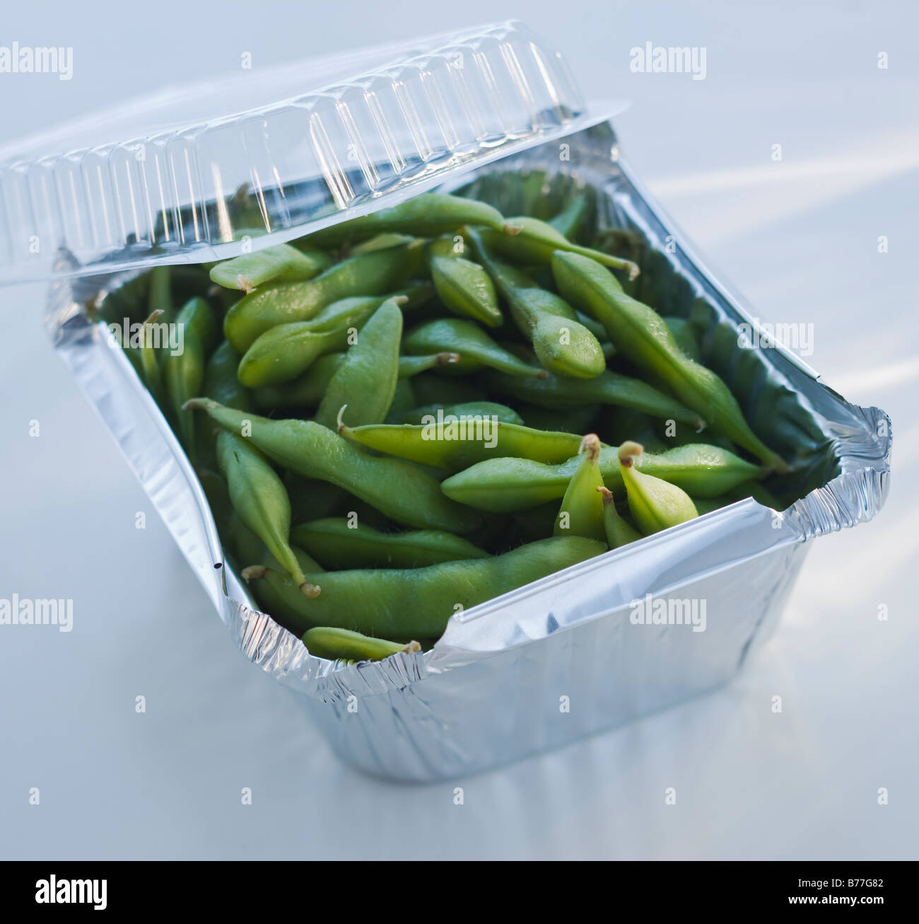 Close up of edamame takeout container Stock Photo - Alamy