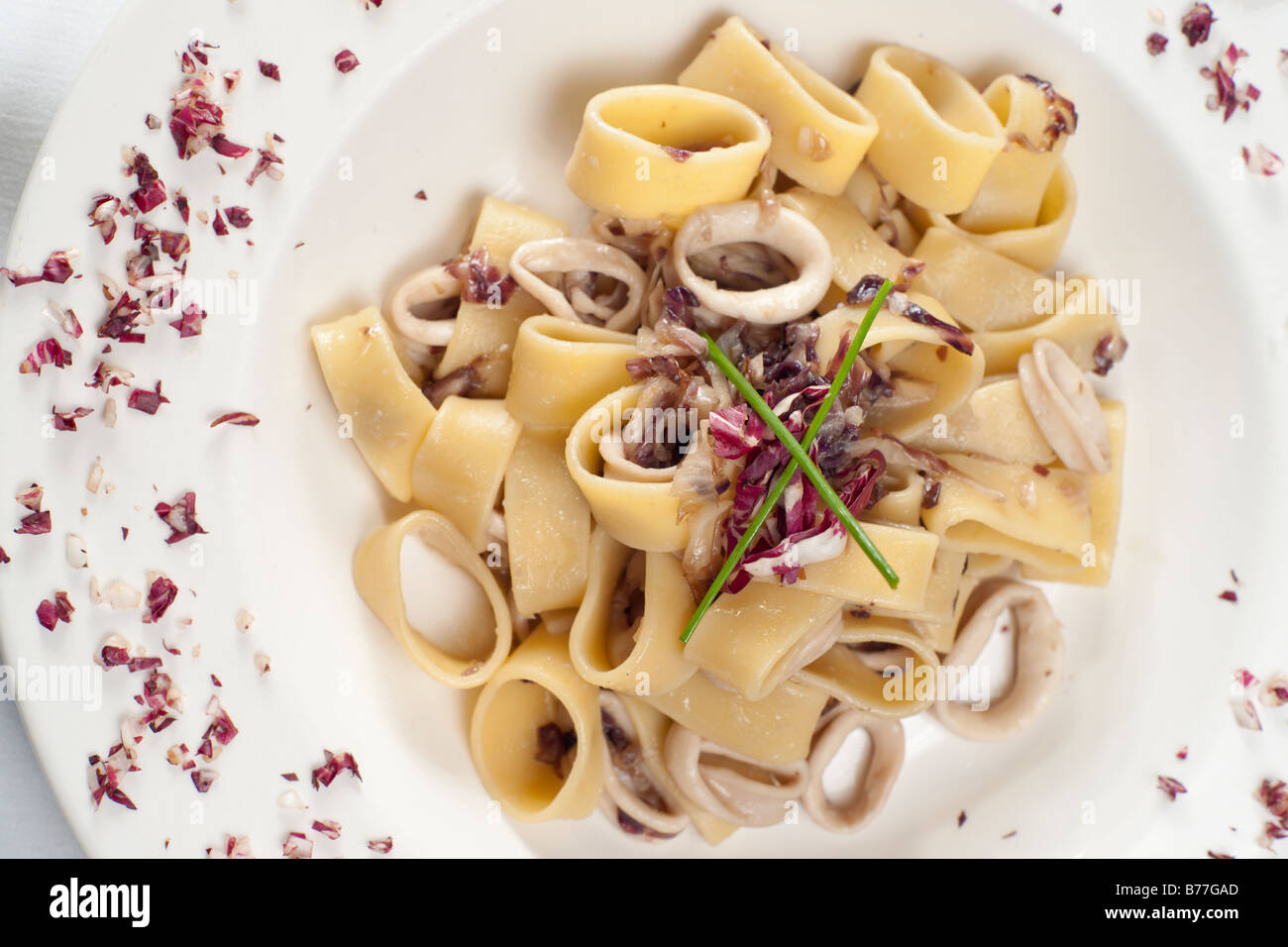 Pasta ai totani. Italian pasta with fish Stock Photo - Alamy