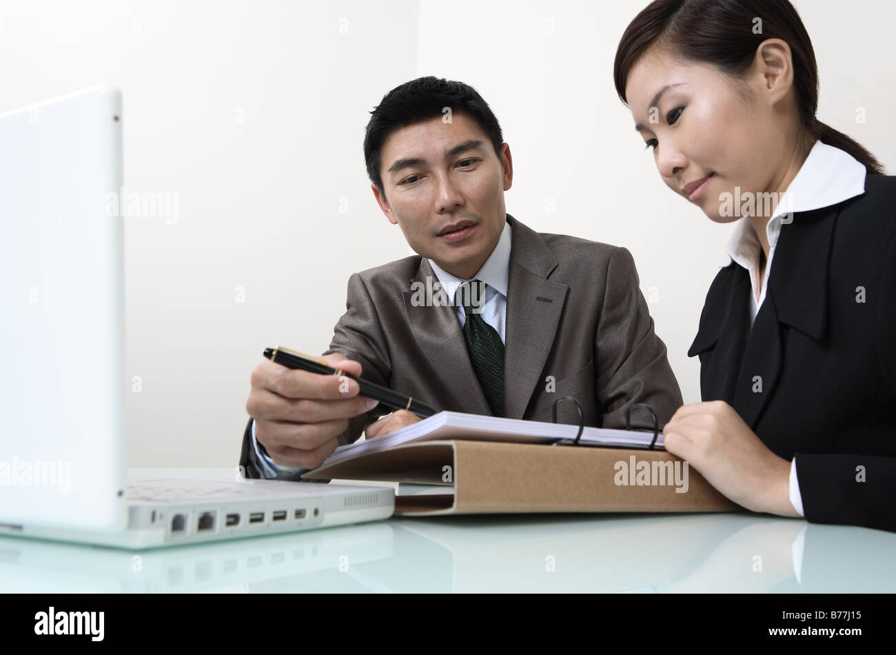 Asian executive at work Stock Photo - Alamy