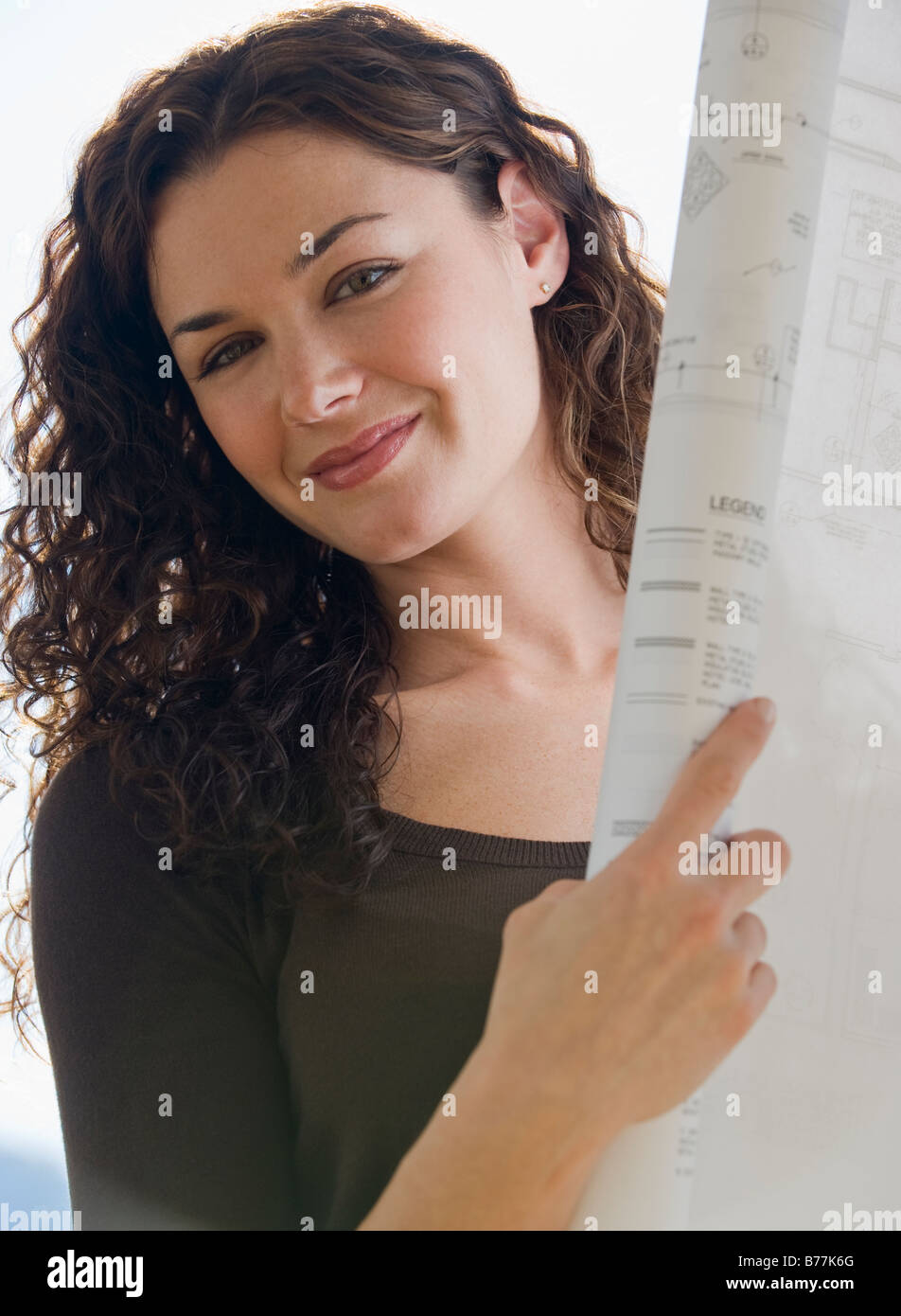 Close up woman looking blueprints hi-res stock photography and images ...