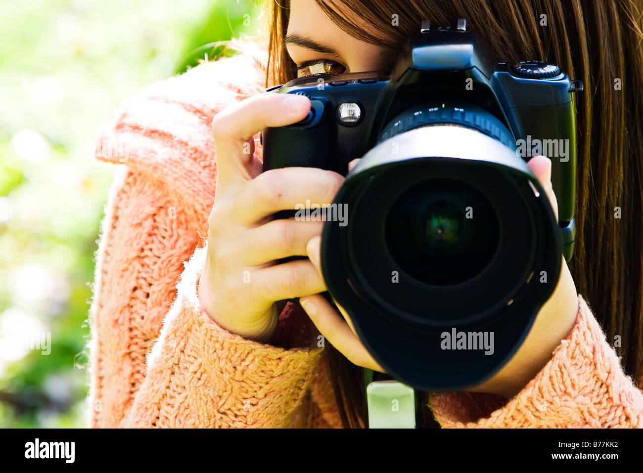 Young woman eye behind slr camera Stock Photo - Alamy