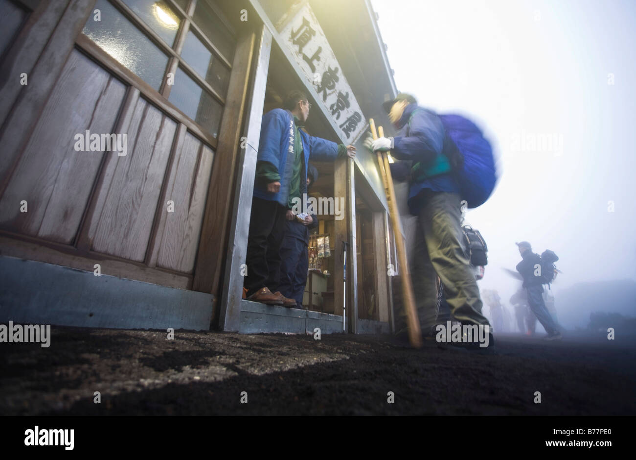Mountain climbers at a summit hut at sunrise, Mount Fuji, Japan, Asia ...