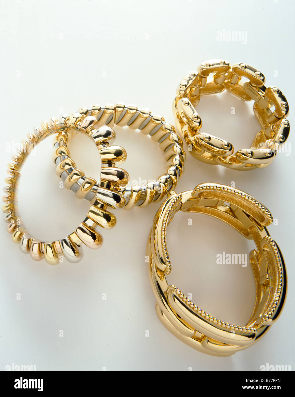 four gold bracelets Stock Photo - Alamy