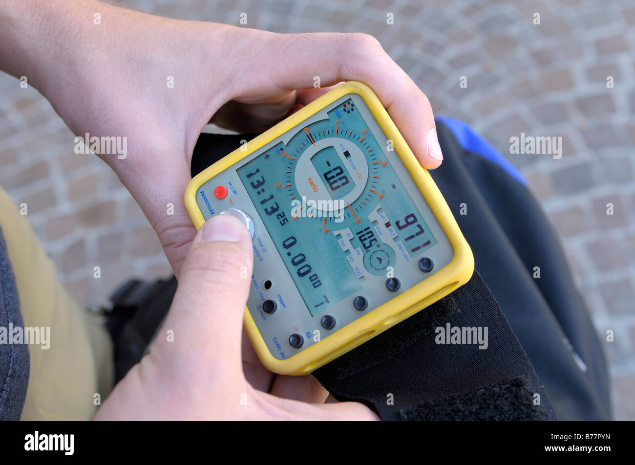 Paraglider adjusting his flight instrument, detail, Sterzing, Province ...