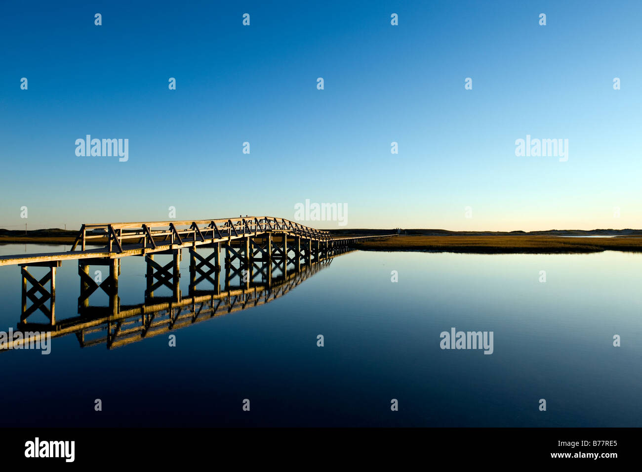 Boardwalk extending over the salt pond and marsh to the beach ...