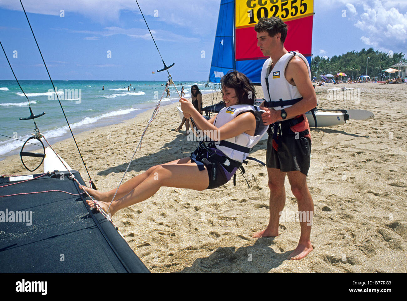 Man teaching girl to hike out on sailboat,Ft. Lauderdale,Florida Stock ...