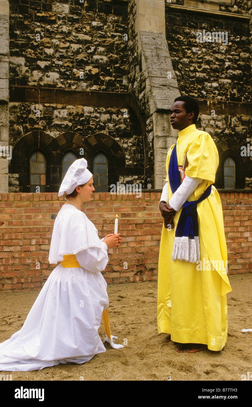 Praying priest kneels hi-res stock photography and images - Alamy