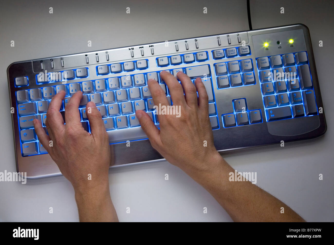 hands typing computer keys during work Stock Photo - Alamy