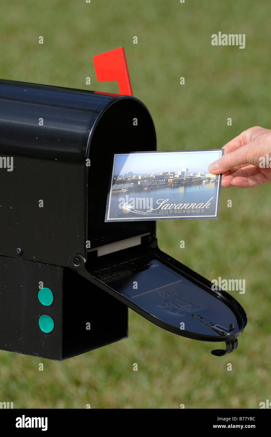 Picture postcard of Savannah Georgia USA being put into a mailbox for ...