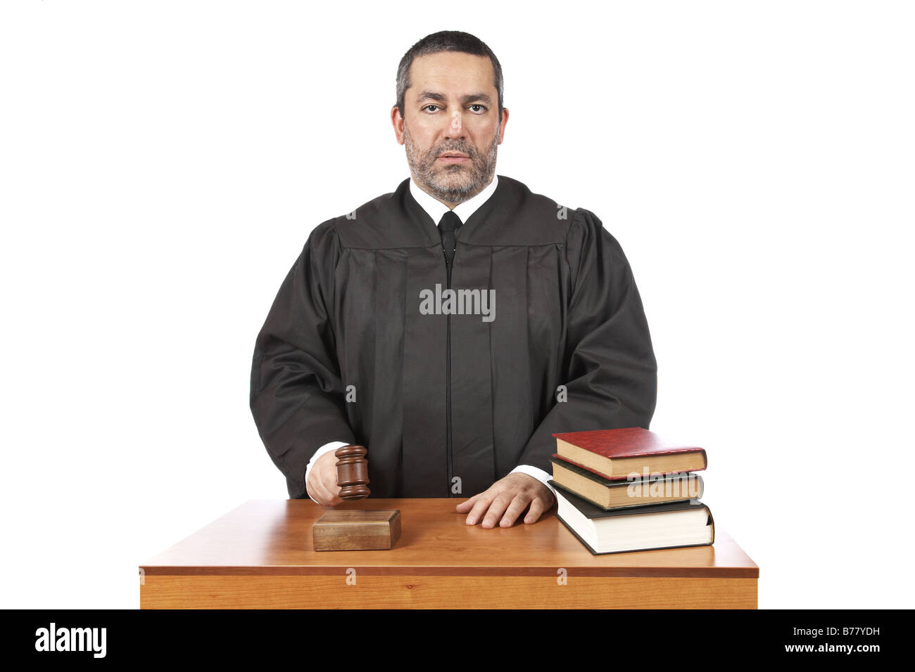 A male judge in a courtroom striking the gavel and pronounces sentence ...