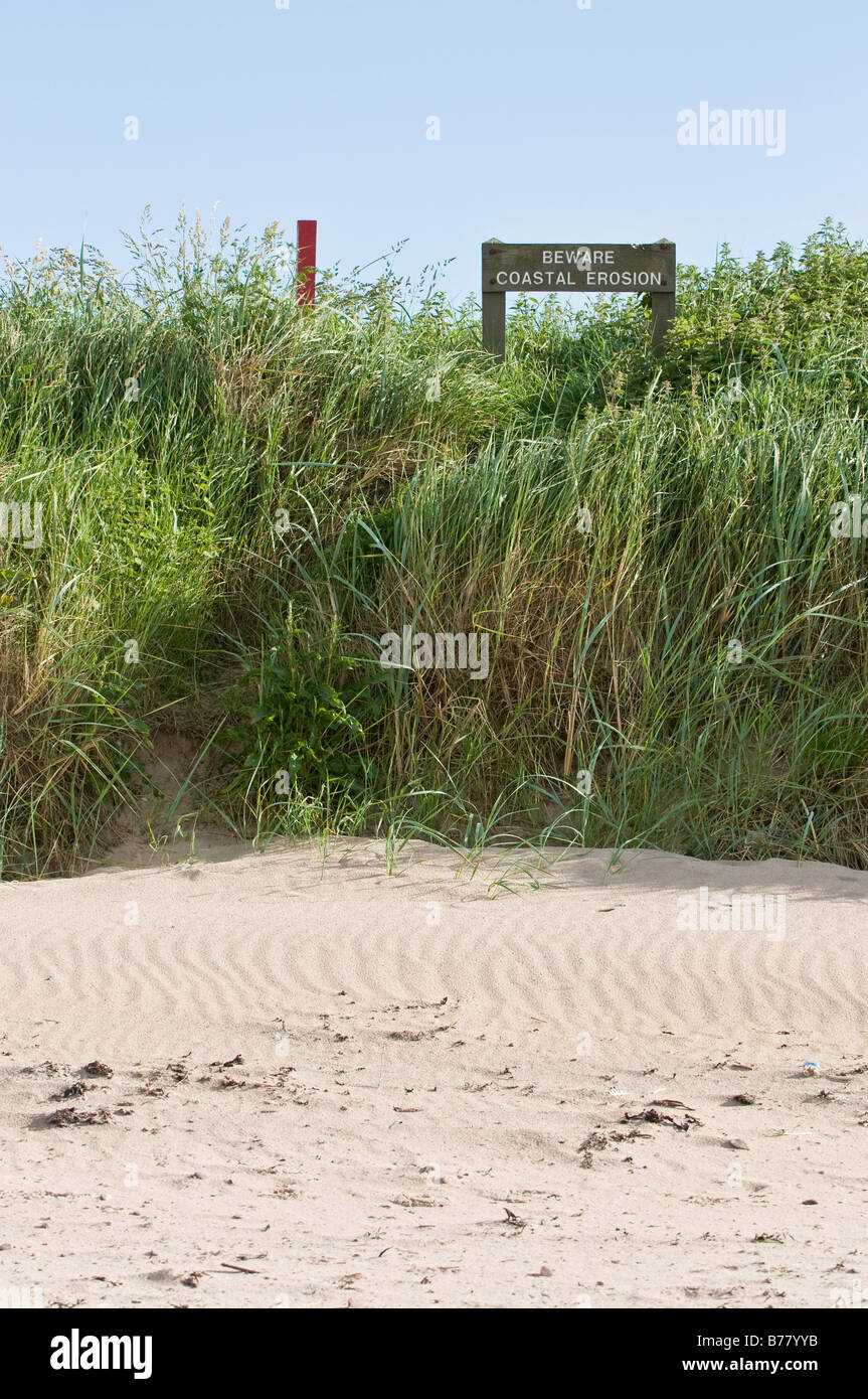 "Coastal erosion" sign on the beach in Scotland Stock Photo - Alamy