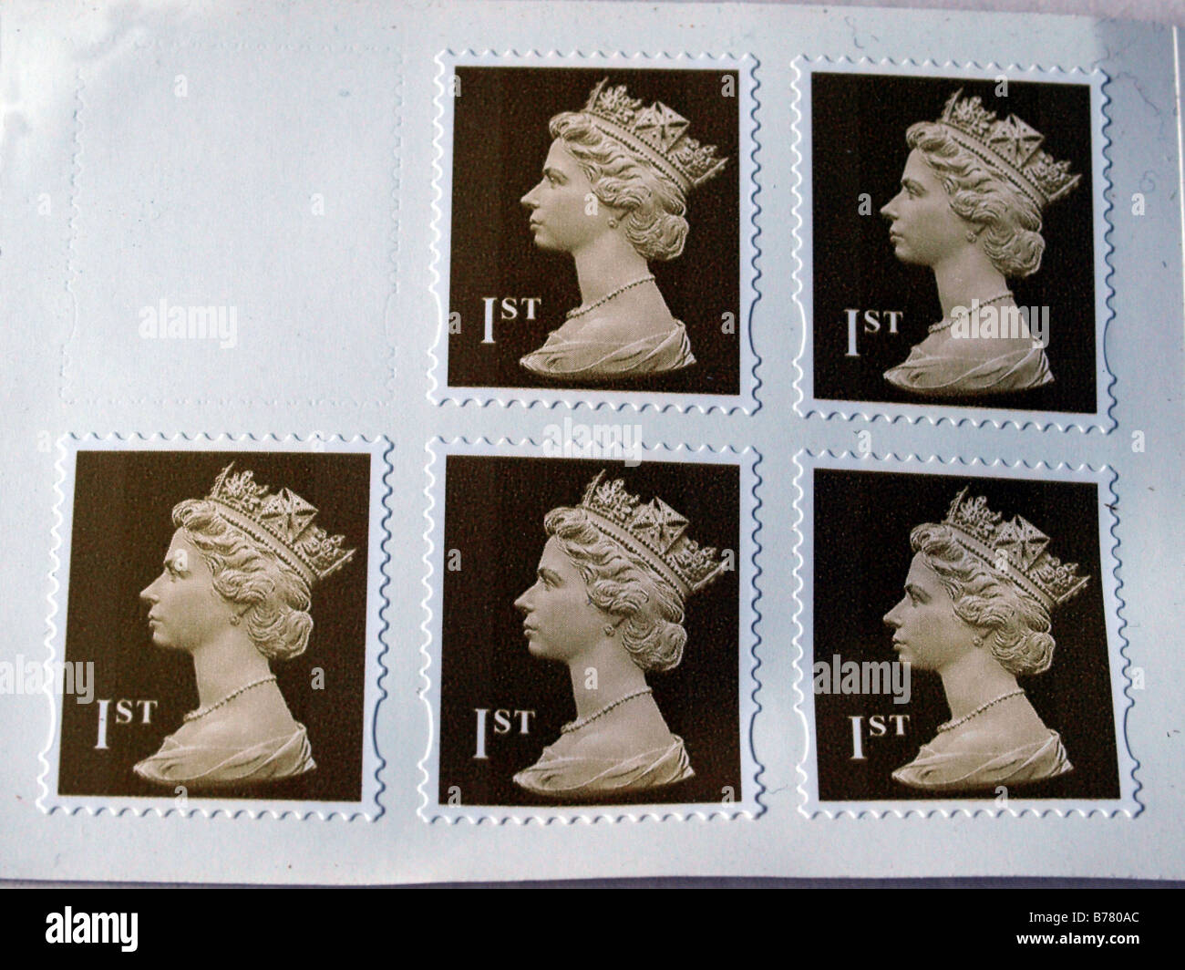 A book of six uk first class stamps,with one used Stock Photo - Alamy