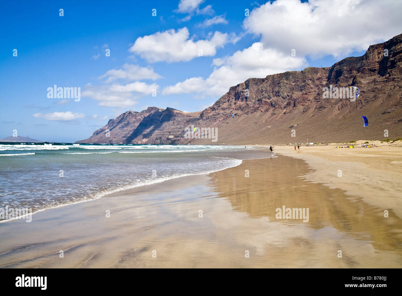 Playa de Famara risco de famara beach Mountain sand rocks reflection ...