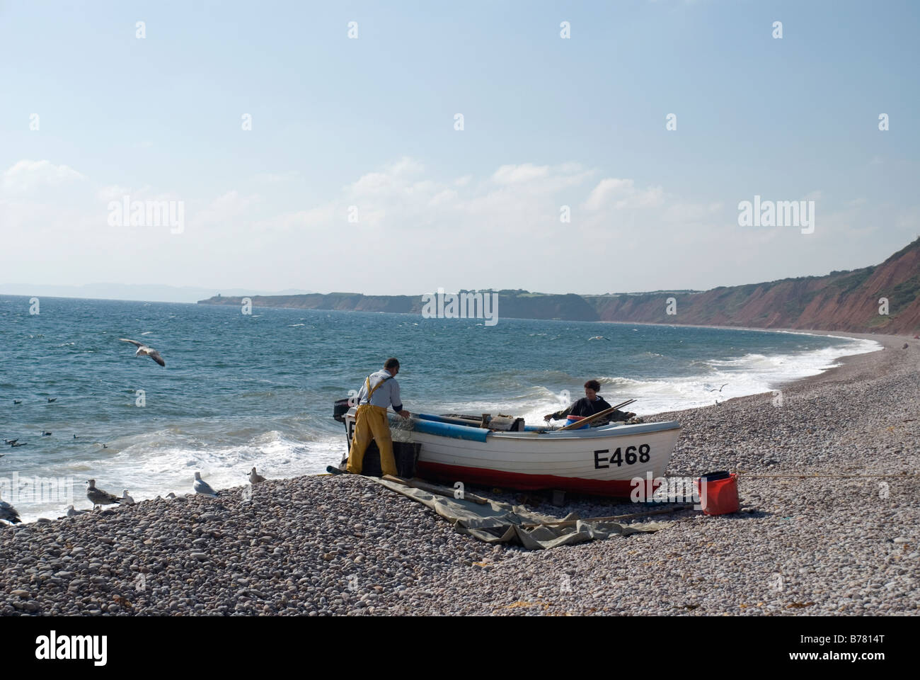 Fishermen with boat at Budleigh Salterton Devon Stock Photo - Alamy