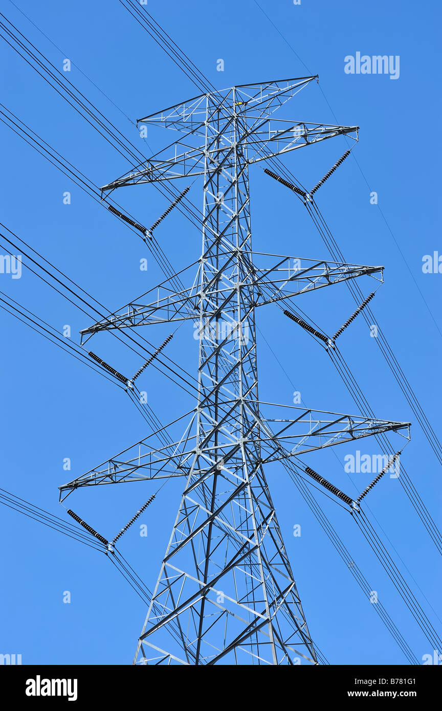 Power line and electricity pylon against clear blue sky Stock Photo - Alamy