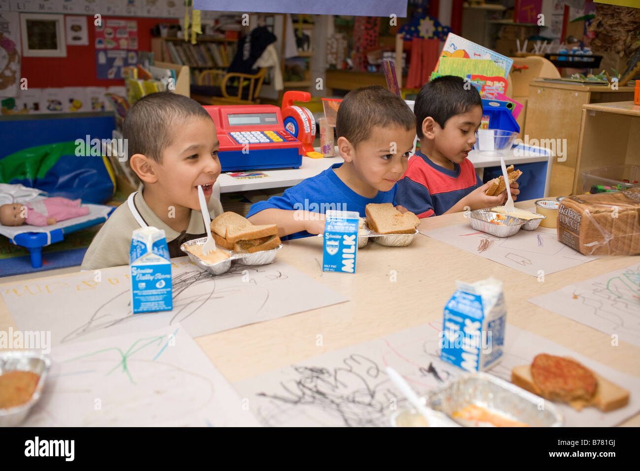 Kids eating in preschool classroom hi-res stock photography and images ...