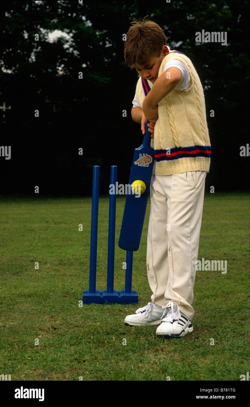 London, UK. Children learning to play cricket with private tuition ...