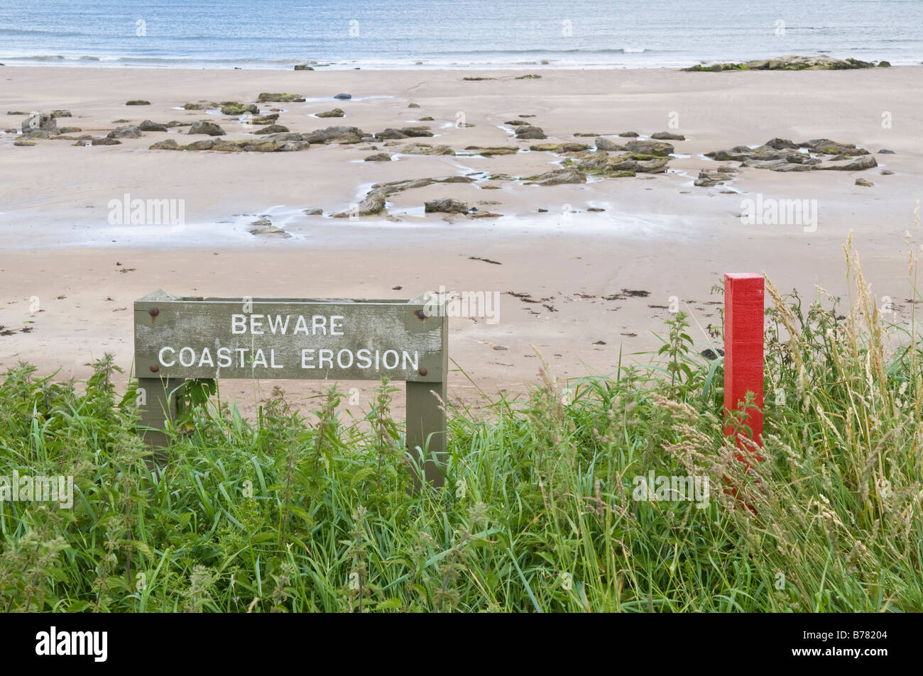 "Coastal erosion" sign at a beach in Scotland Stock Photo - Alamy