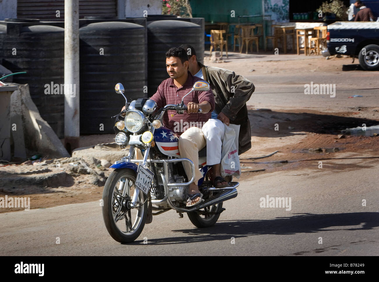 Two men on motorcycle, Dahab, Egypt Stock Photo - Alamy