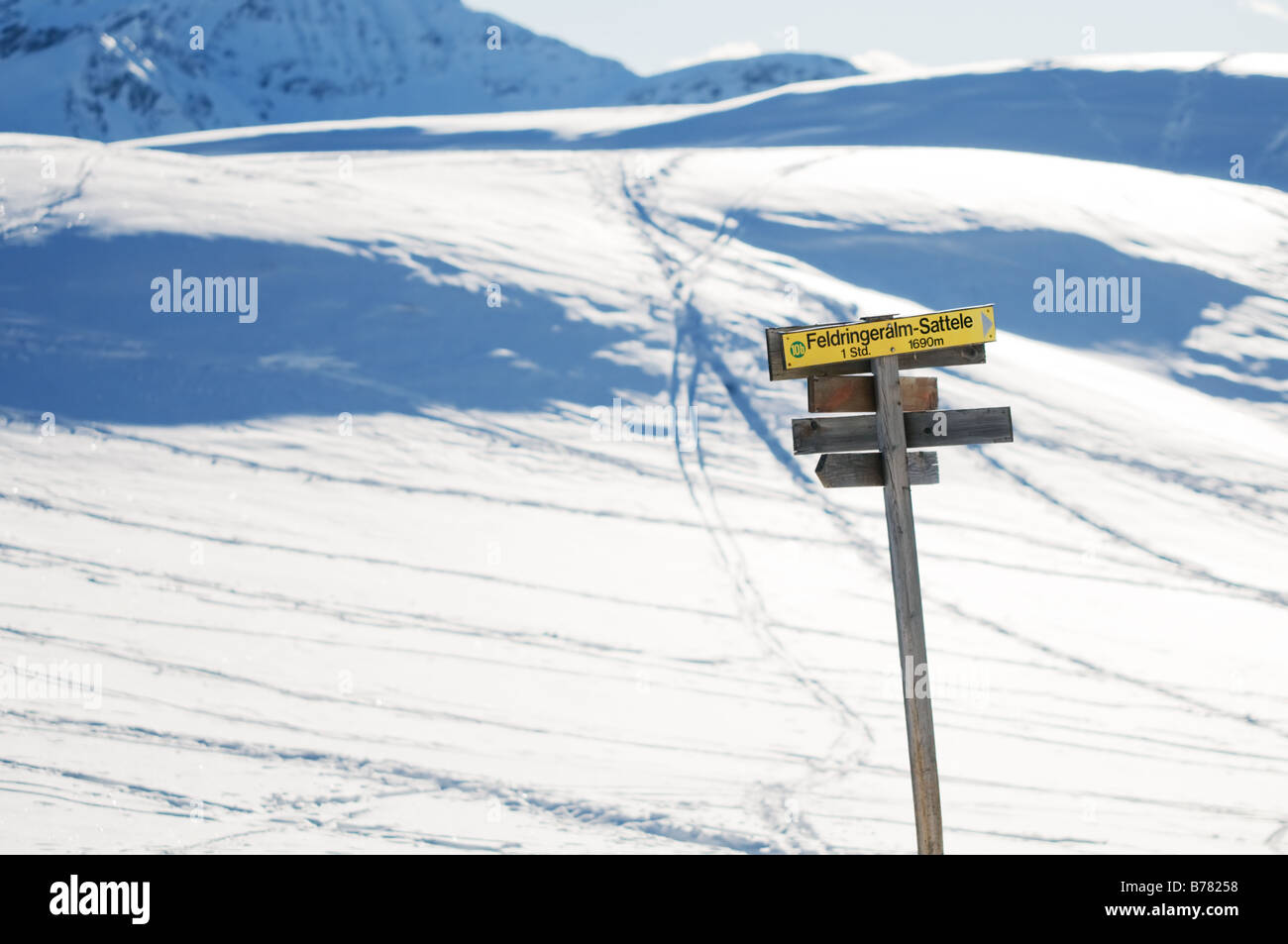Snowy winter landscape and sign. The Alps Stock Photo - Alamy