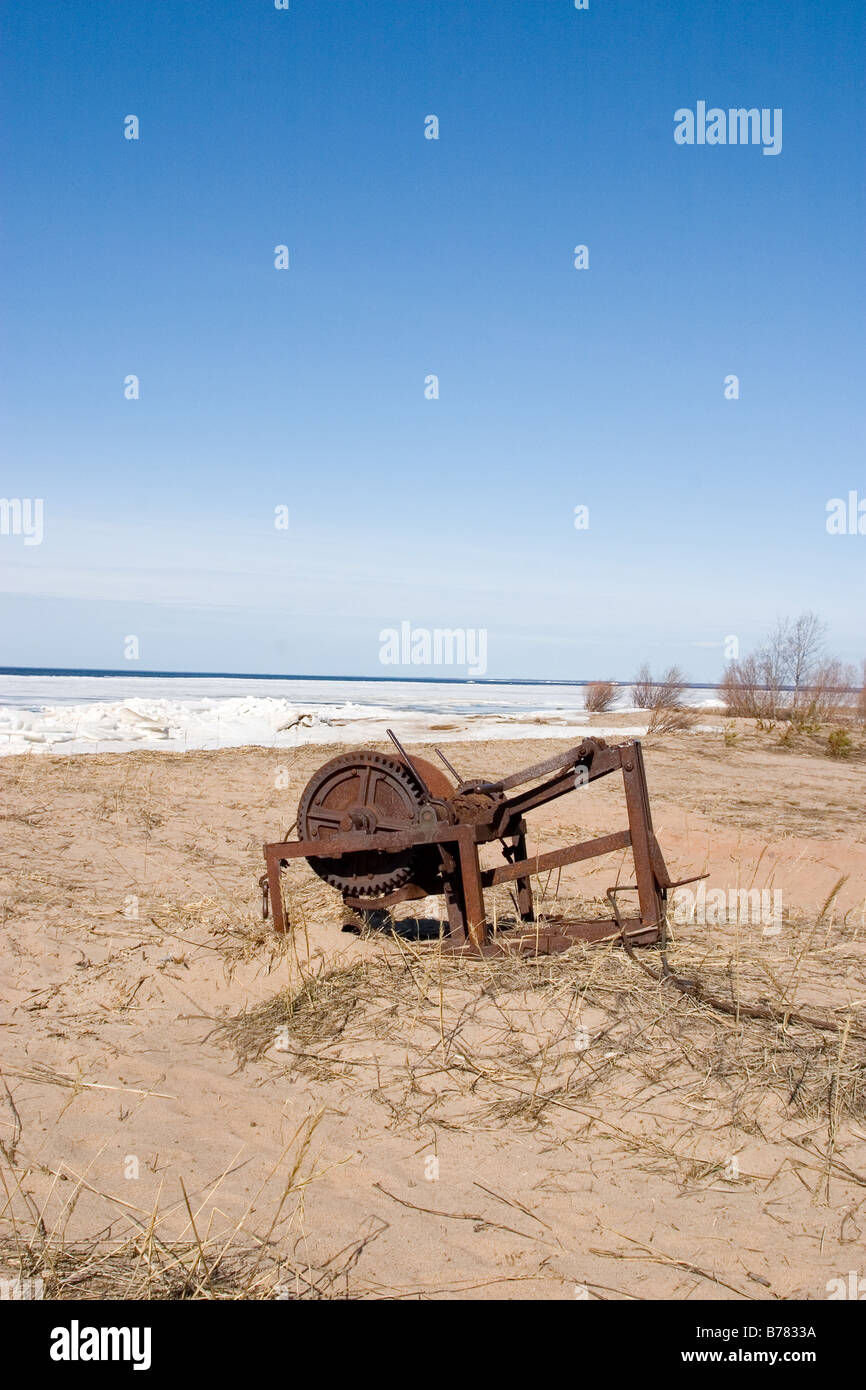 a disused winch on a beach Stock Photo - Alamy