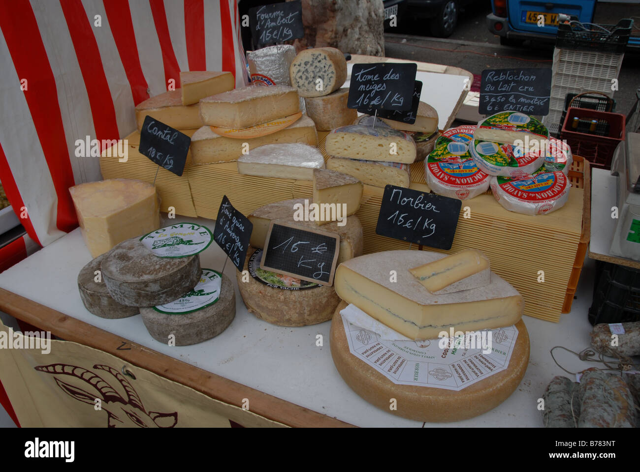 French cheeses on sal at a market stall at a Sunday morning fruit veg ...