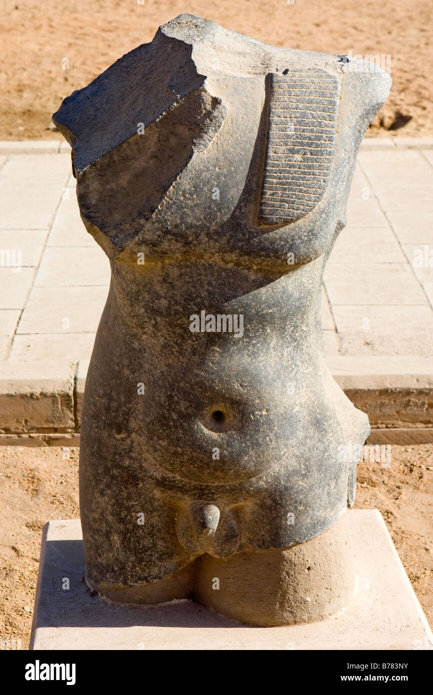 Sculptured torso of statue in the open air museum at Edfu Temple Egypt ...