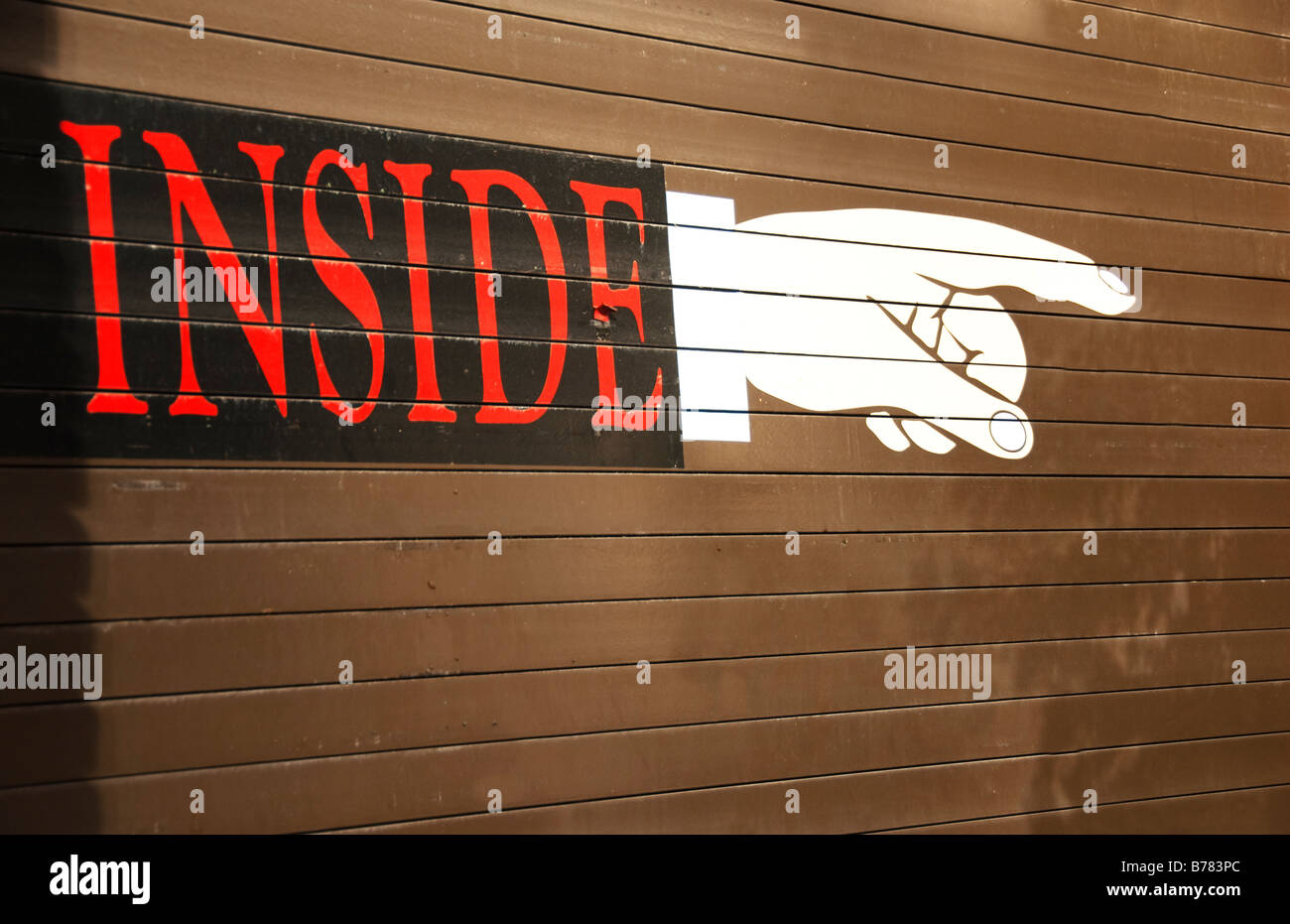 Hand pointing building red hi-res stock photography and images - Alamy