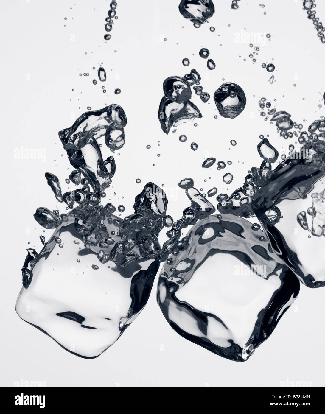 ice cubes splashing in water Stock Photo - Alamy