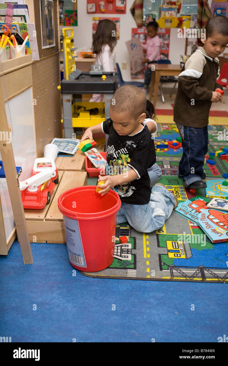 4 year old preschool boy playing on the floor Stock Photo - Alamy