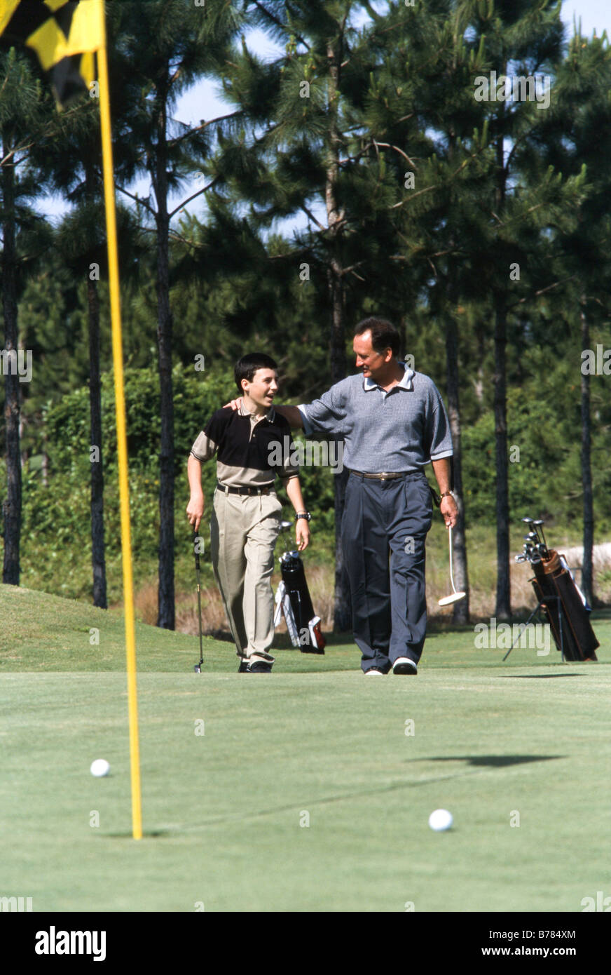 Father teaching son golf hi-res stock photography and images - Alamy