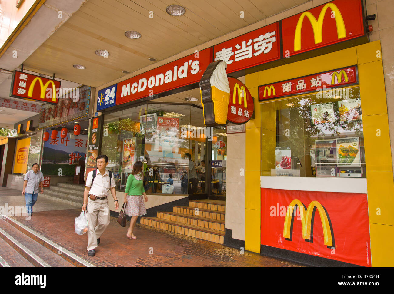 SHENZHEN, GUANGDONG PROVINCE, CHINA - People walk by McDonald's ...