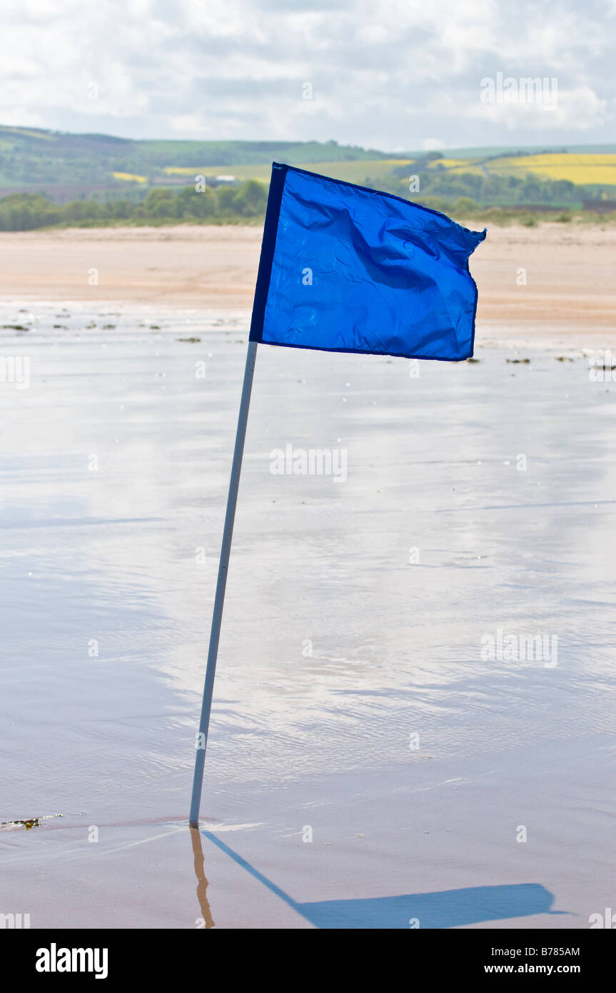 Blue flag signifying safe swimming at the beach Stock Photo - Alamy