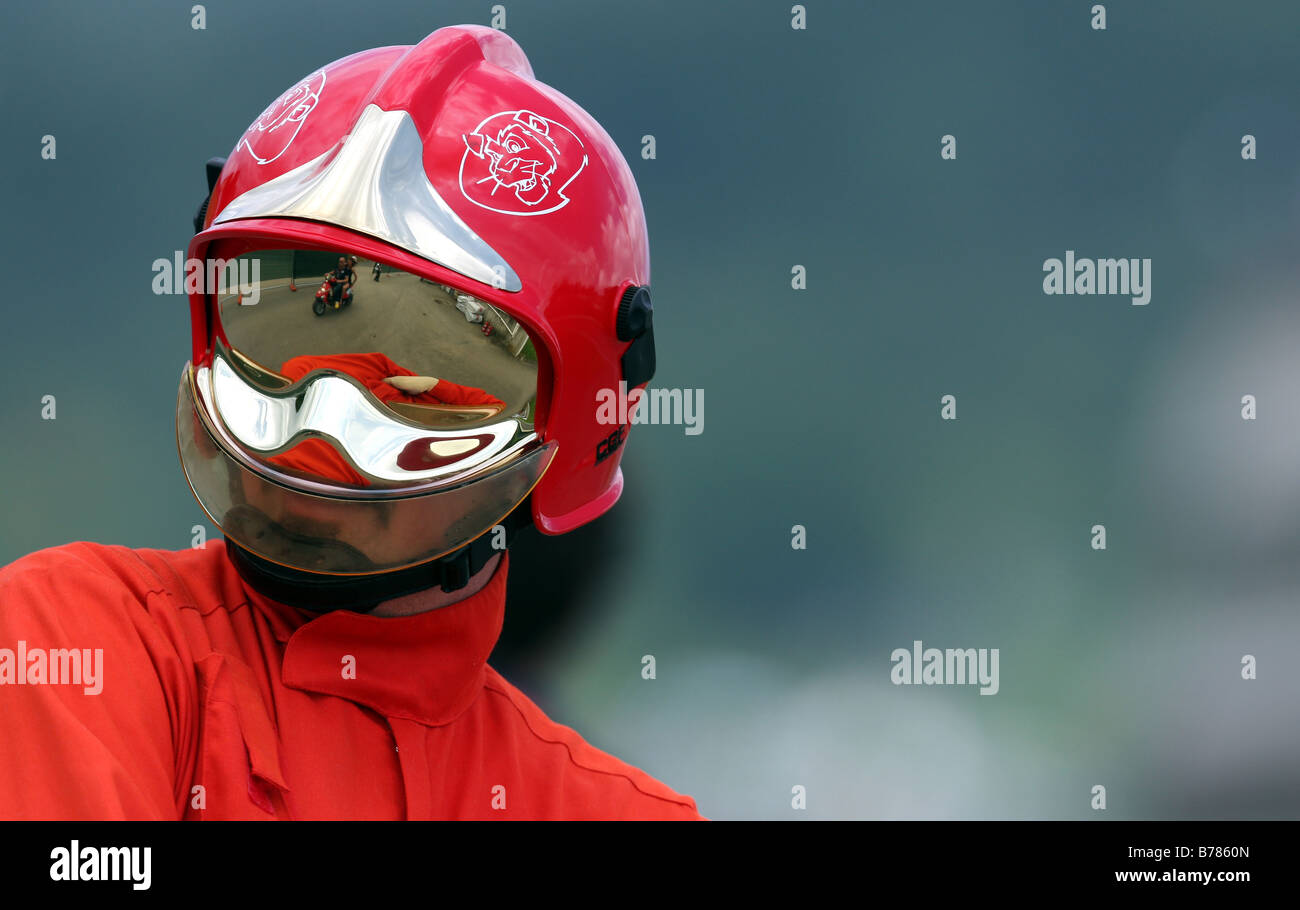 italian fireman in a reflective heat mask at mugello racing circuit ...