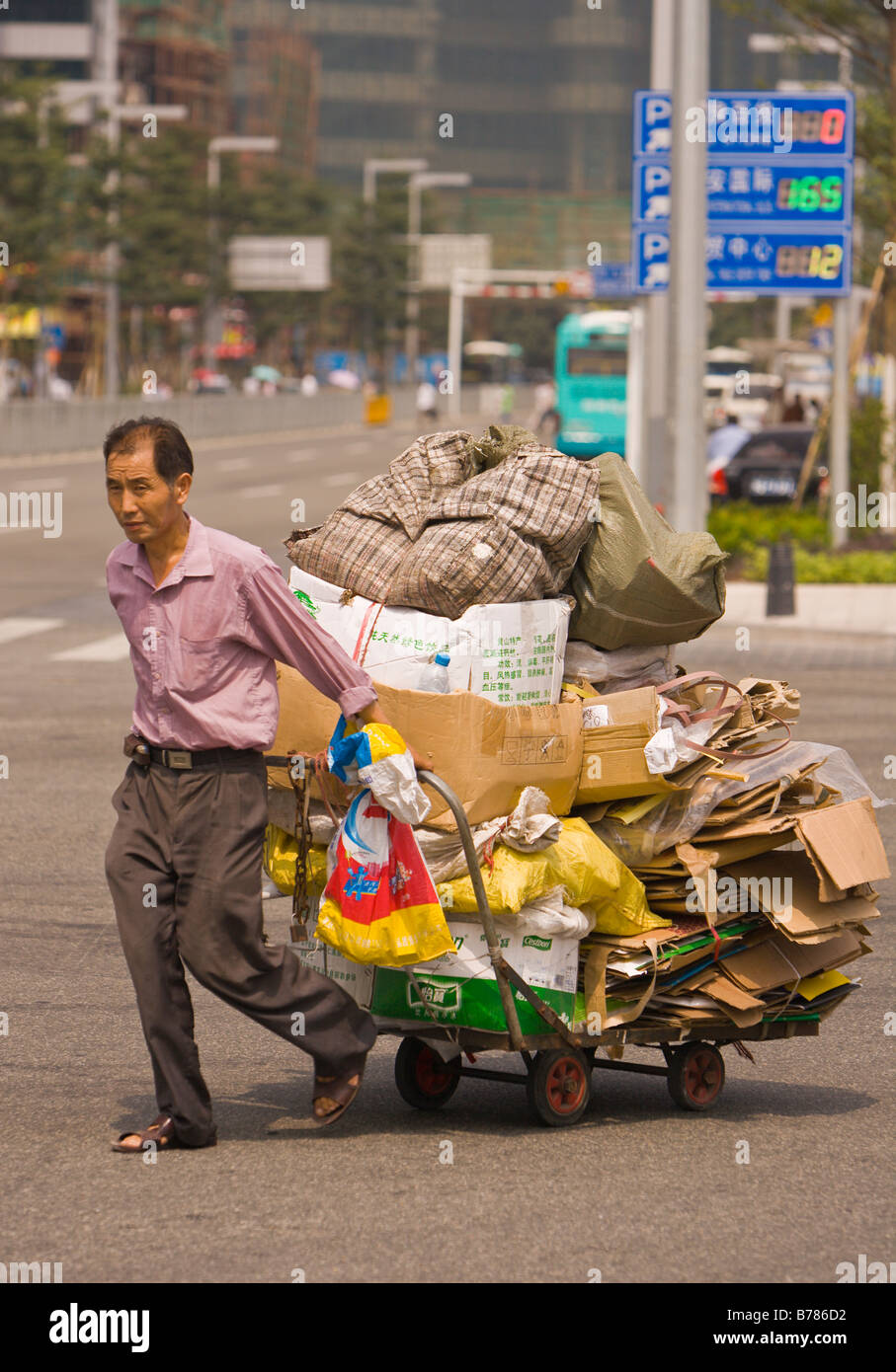 Man hauls cart on street hi-res stock photography and images - Alamy