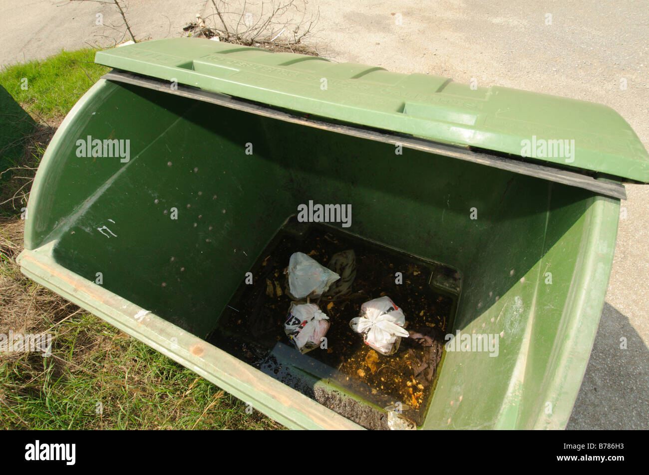 Abandoned waste bin filled by rain water Spain Stock Photo - Alamy